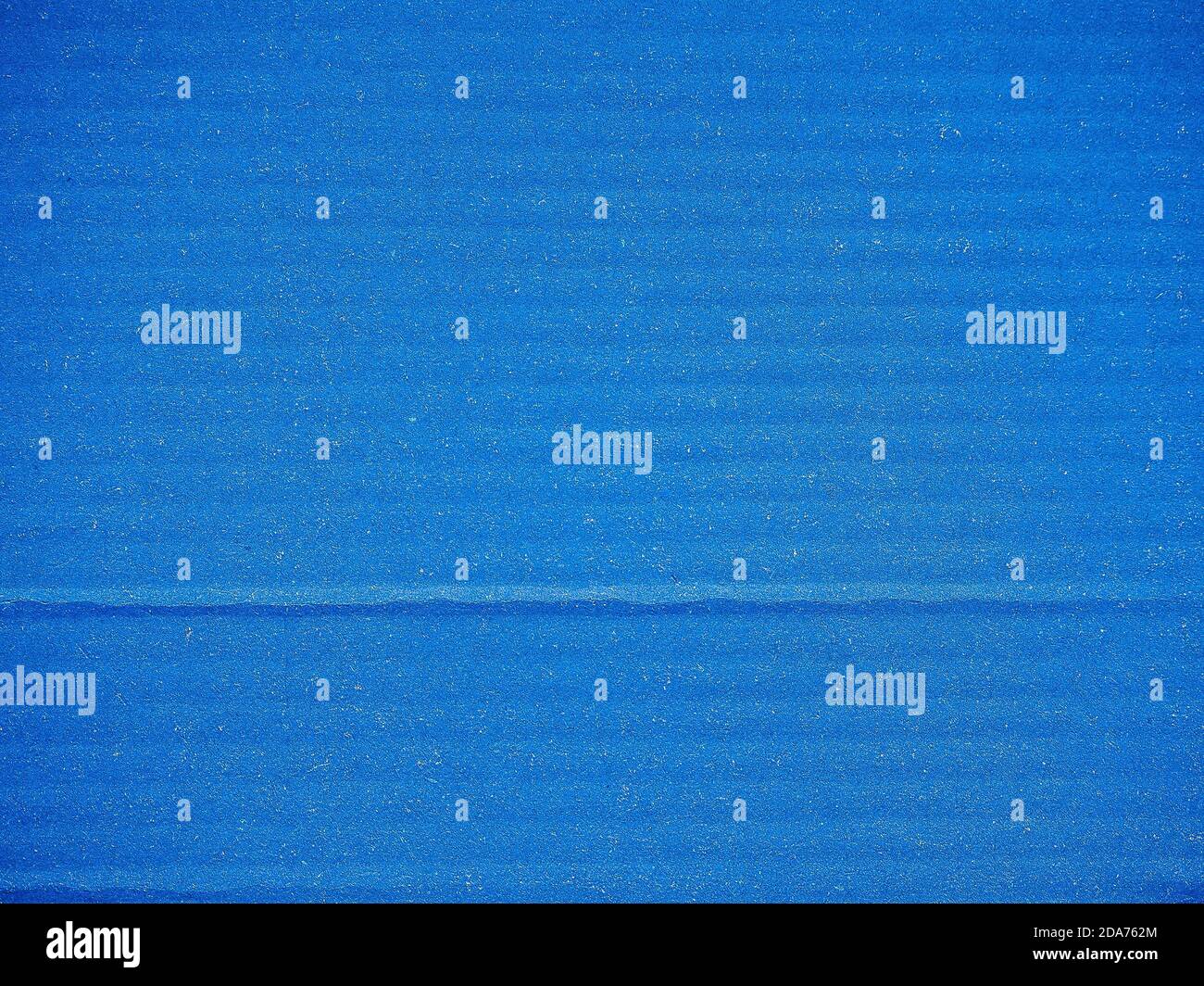Blue corrugated cardboard useful as a background Stock Photo - Alamy