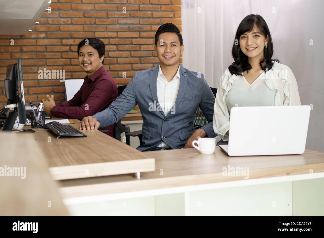 Portrait of happy coworkers. Show confidence ready to work Stock Photo ...