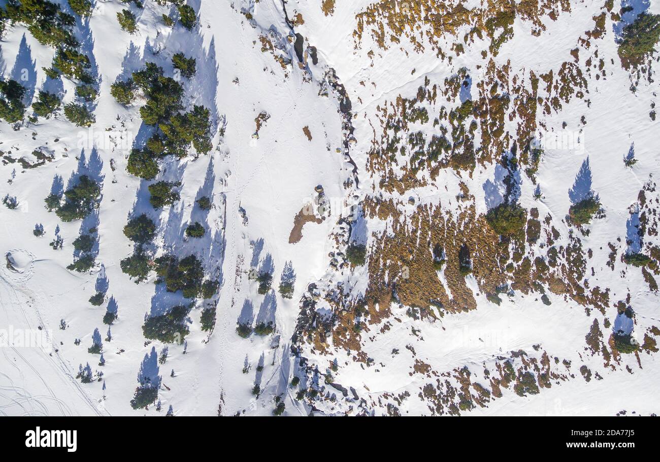 Aerial views of the Pyrenees in winter, where we find snow, rocks and ...