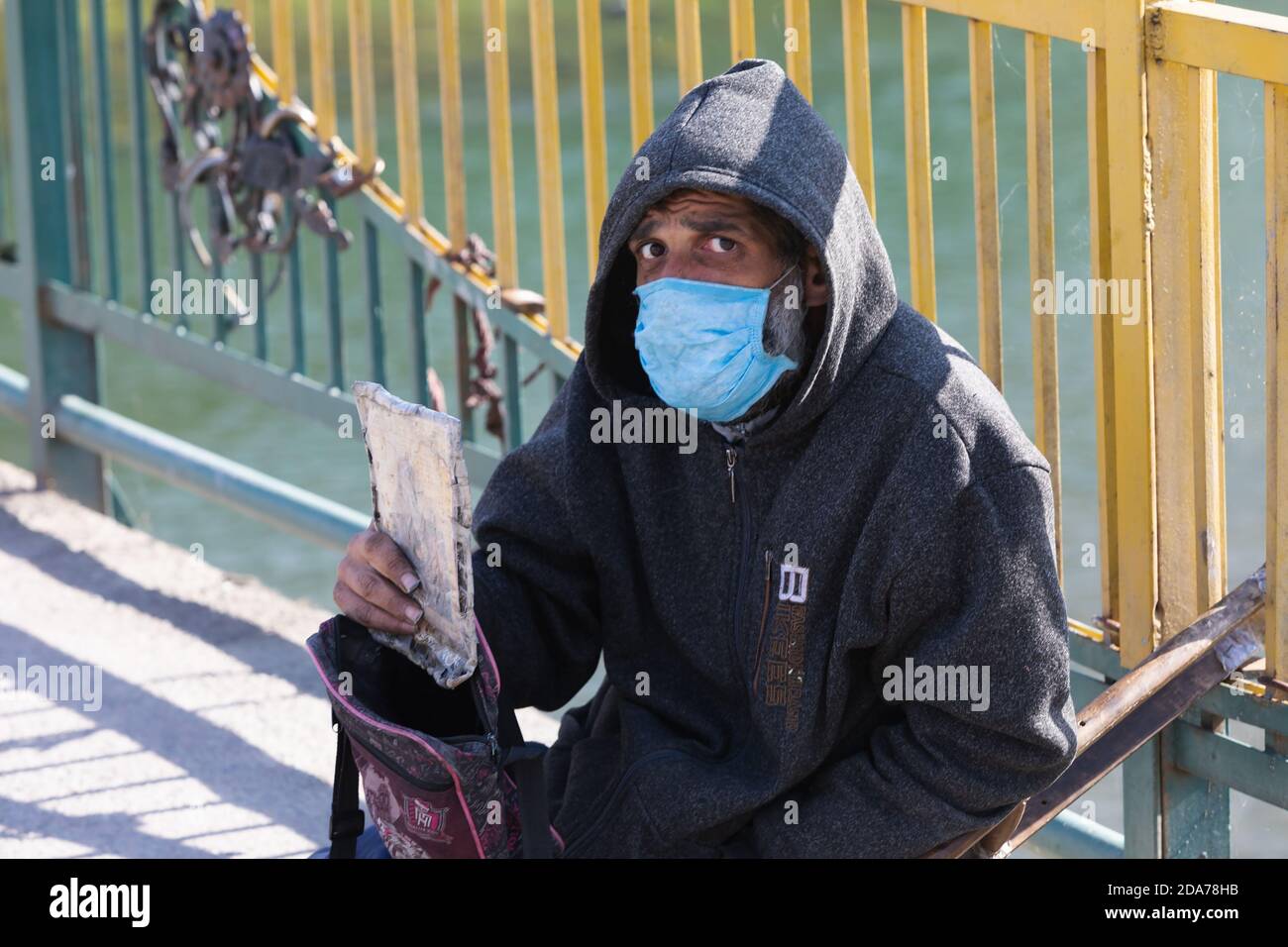 Homeless man face in hands hi-res stock photography and images - Alamy