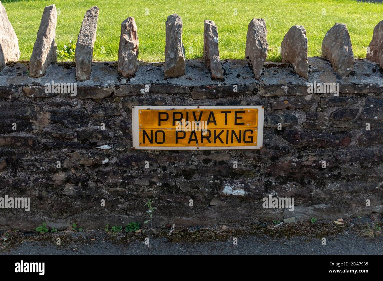 a close up view of a private no parking sign that has been attached on ...
