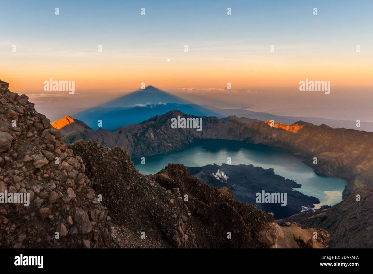 Mount Rinjani (or Gunung Rinjani) landscape at crater rim overlooking into crater lake and its ...