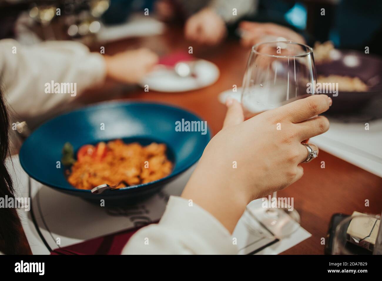 Closeup shot of a person drinking wine in the restaurant Stock Photo ...