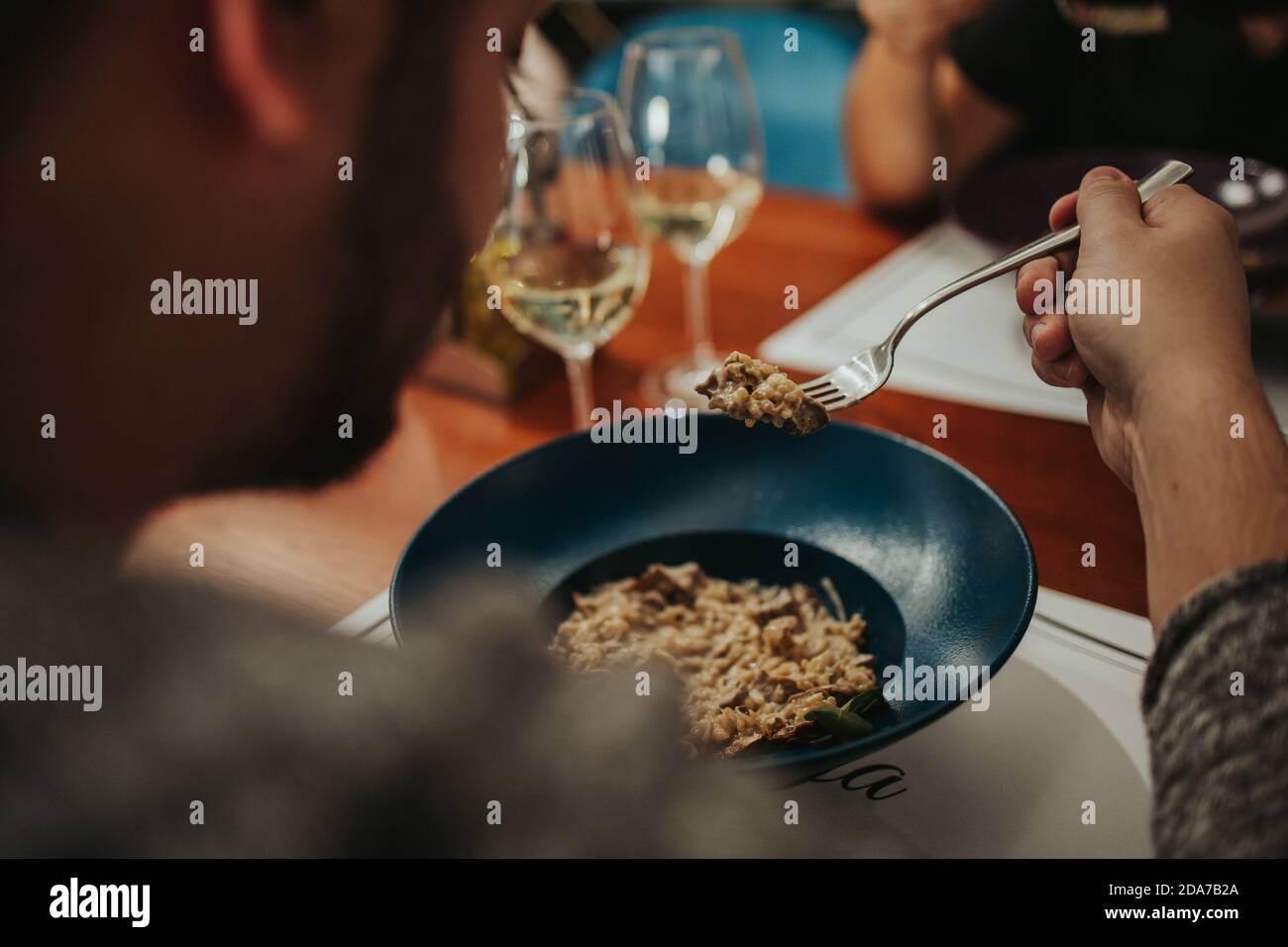 High angle shot of a person eating a dish in the restaurant Stock Photo ...