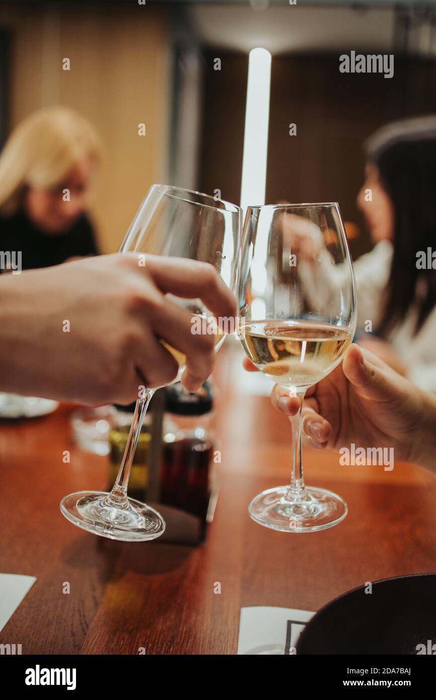 Closeup shot of people drinking wine in the restaurant Stock Photo - Alamy