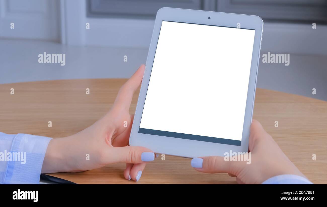 Over shoulder closeup view: woman hands holding digital tablet computer ...