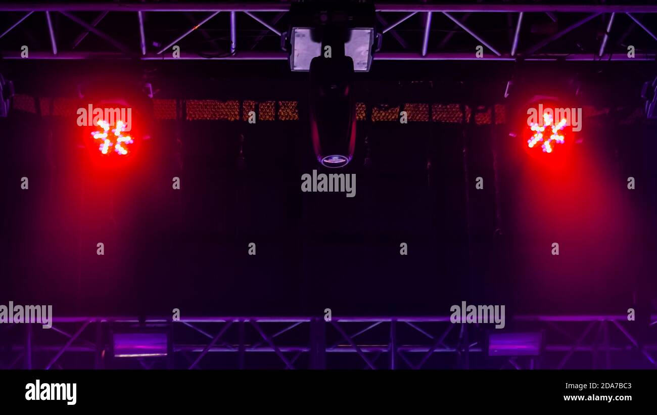 Colorful bright concert lighting equipment for stage at nightclub ...