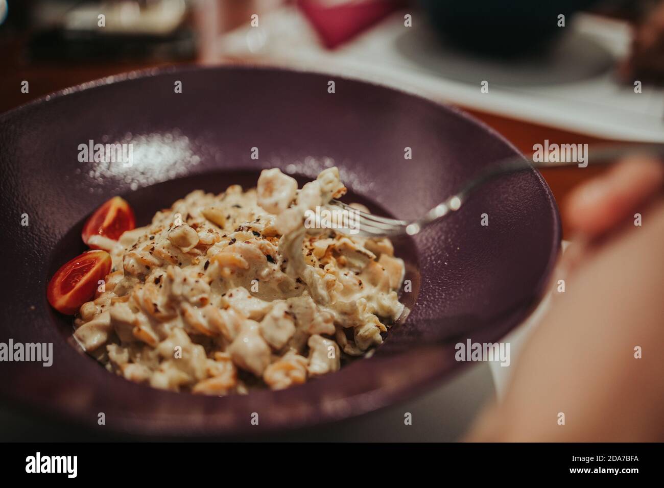 High angle shot of a person eating a dish in the restaurant Stock Photo ...