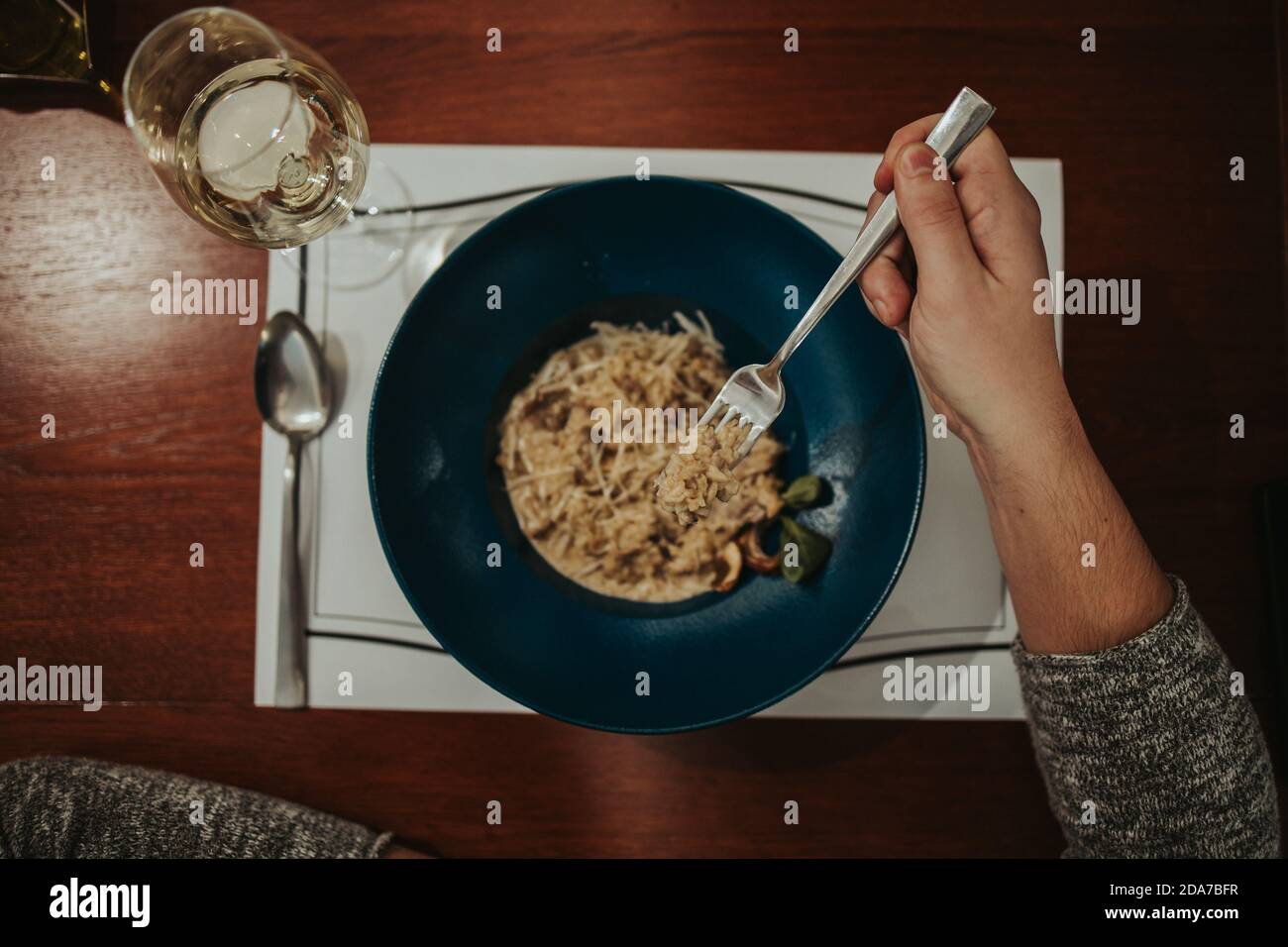 High angle shot of a person eating a tasty dish in the restaurant Stock ...