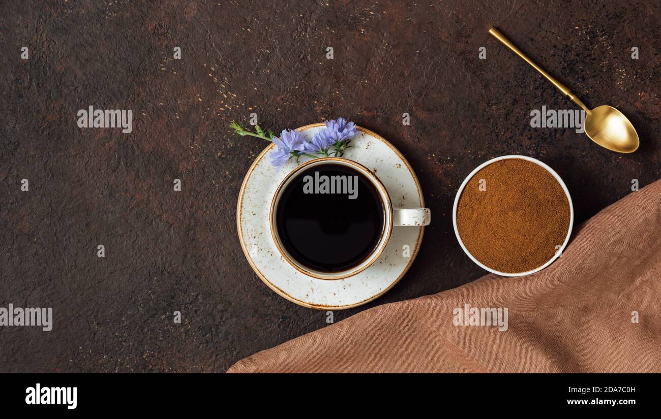 Composition of chicory drink, chicory powder, napkins and spoon on a ...