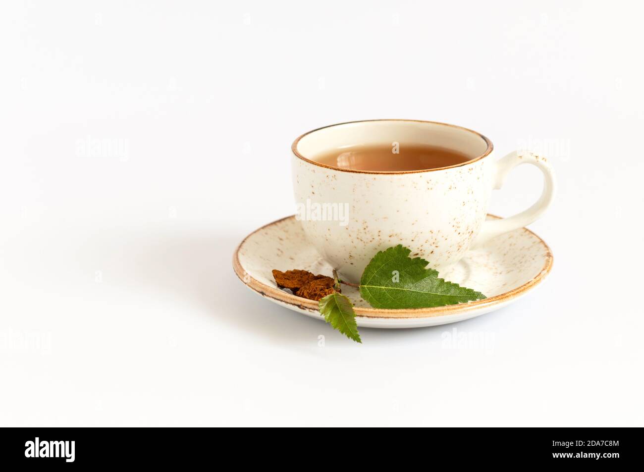 Cup of chaga tea isolated on a white background. Healthy beverage with ...