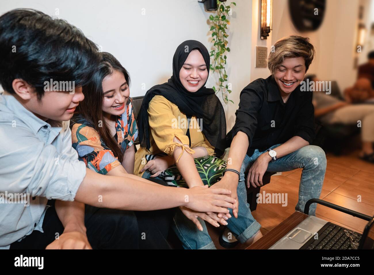 Group of smiling teenagers staying together when work assignment ...