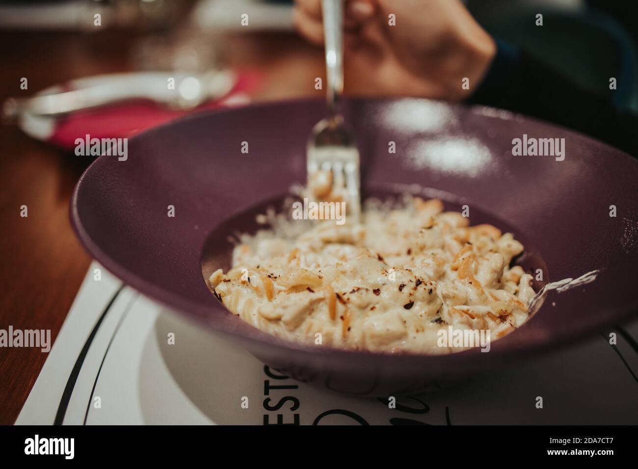 Closeup shot of a person eating a dish in the restaurant Stock Photo ...