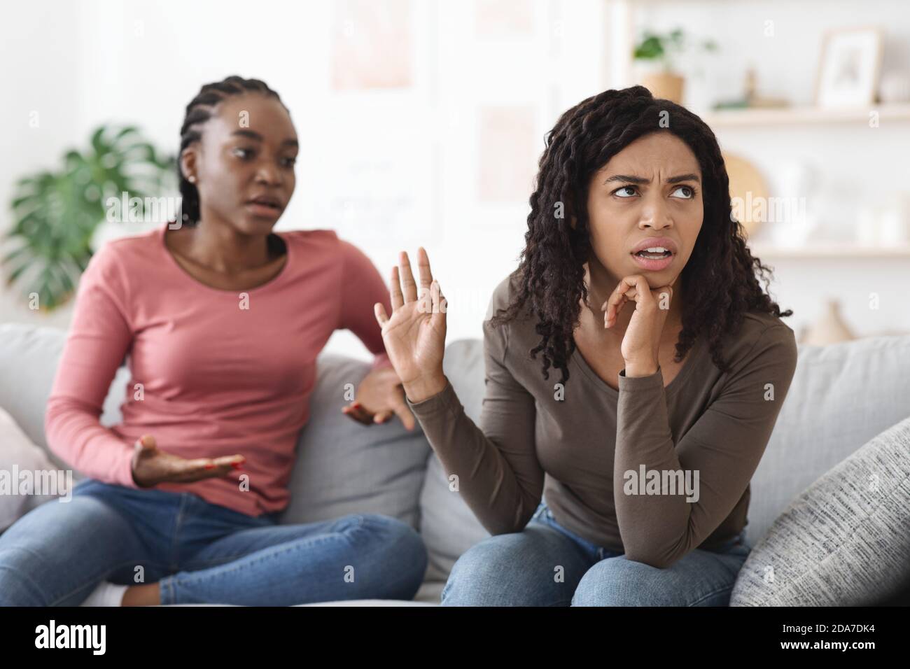 Two african american women fighting at home Stock Photo - Alamy