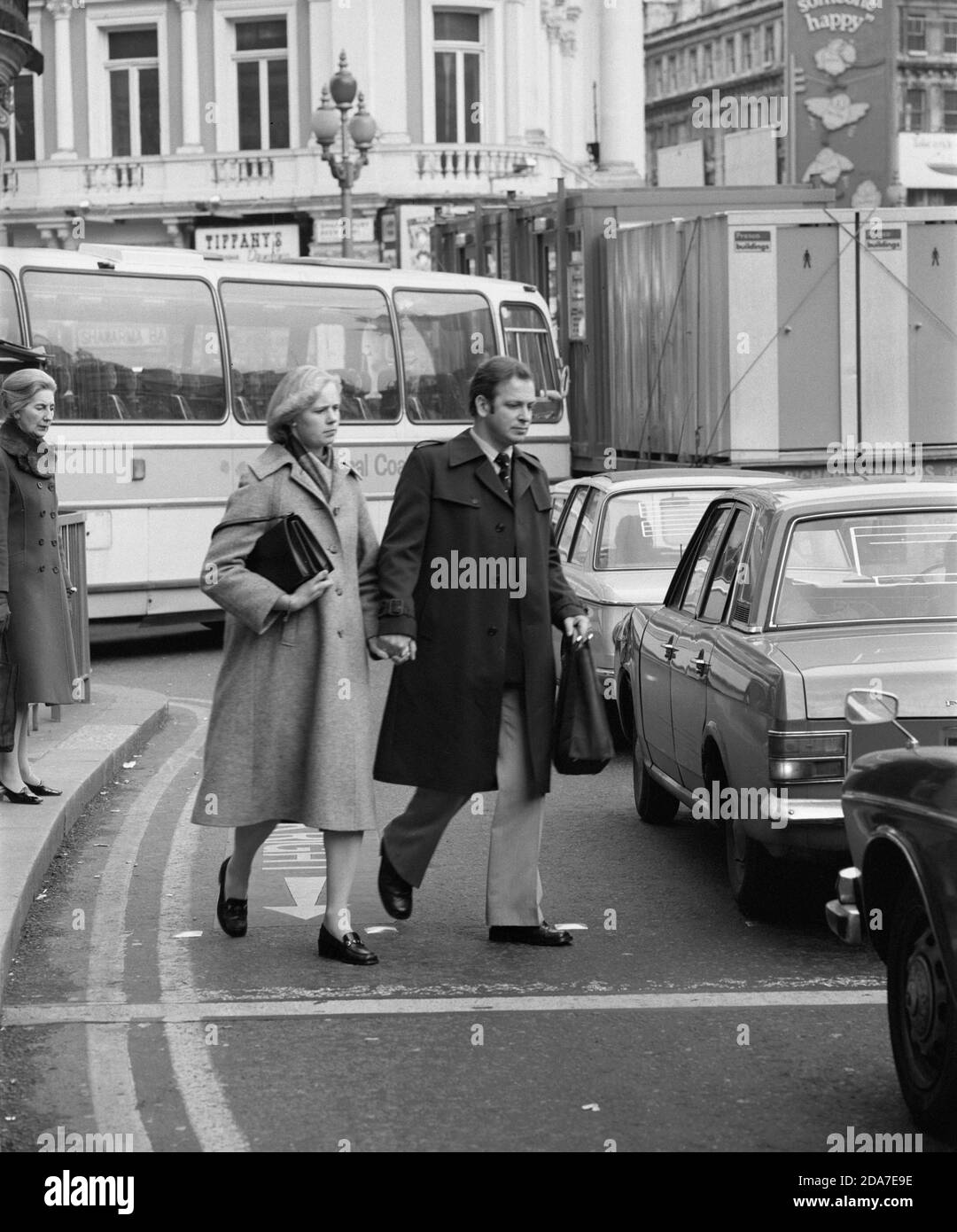 The couple crosses the street, London, England, February 1979 Stock ...