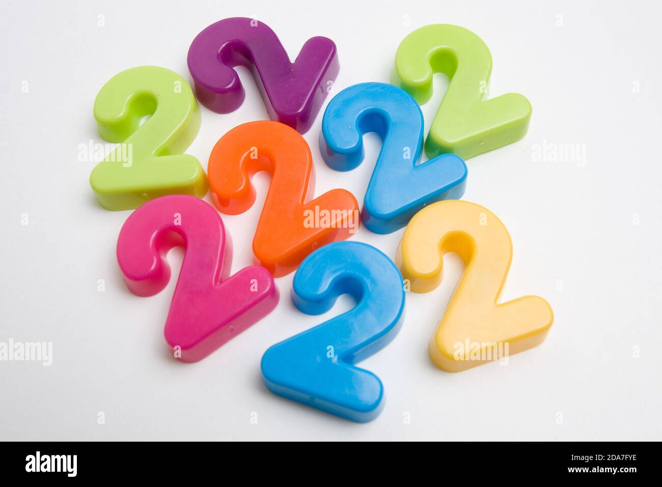 Colourful plastic fridge magnet style numbers and symbols still life ...