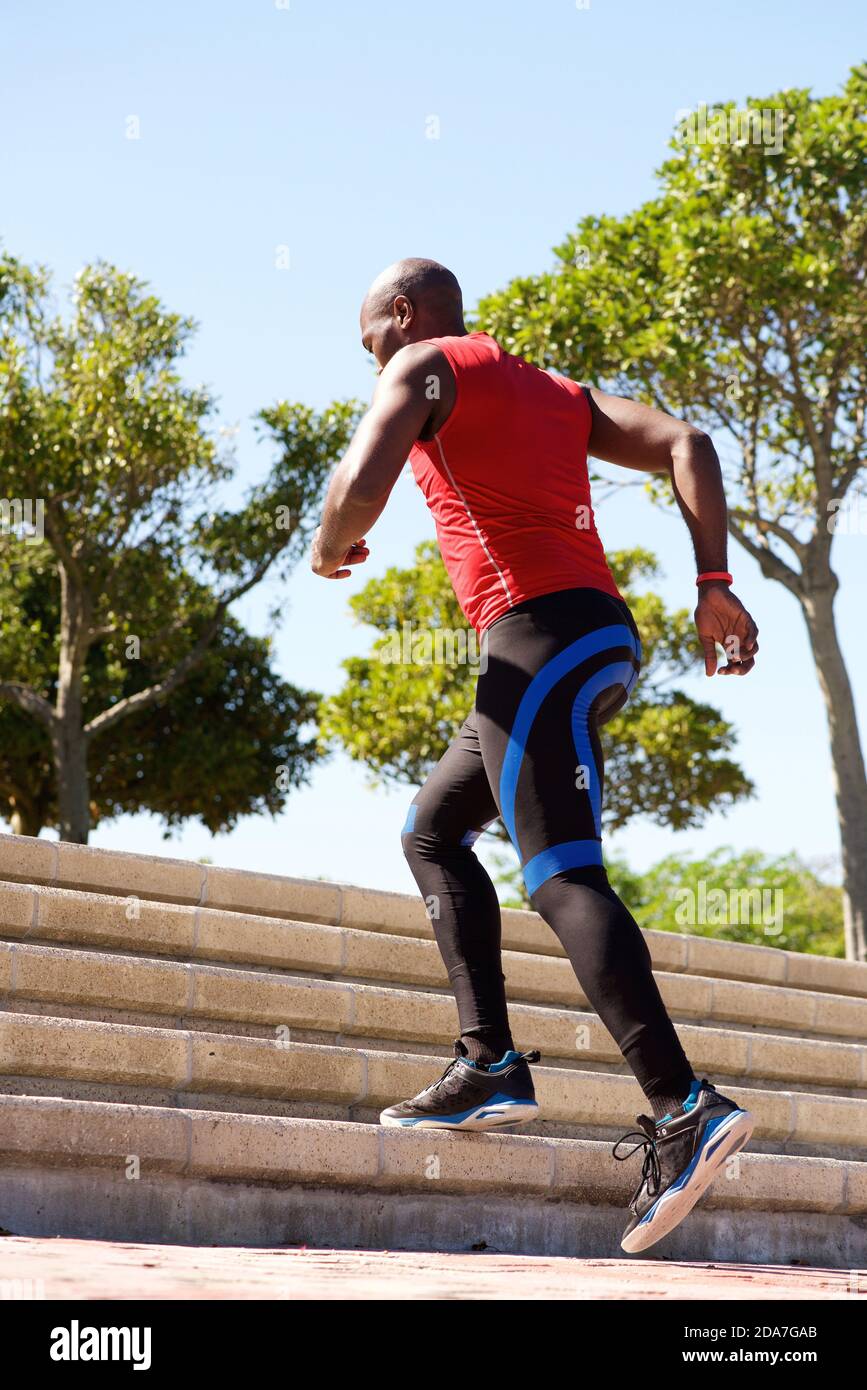Black man running up stairs hi-res stock photography and images - Alamy
