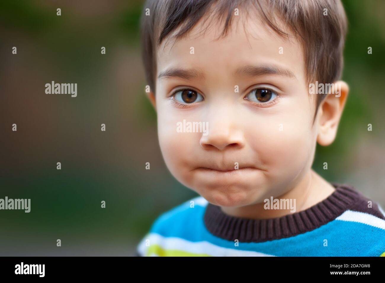 Thinking expression cute boy portrait Stock Photo - Alamy