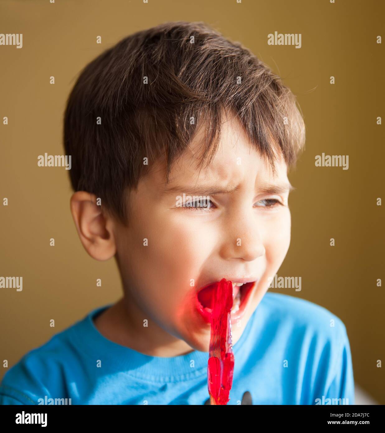Close Up of Young Boy Eating A Lollipop Stock Photo - Alamy