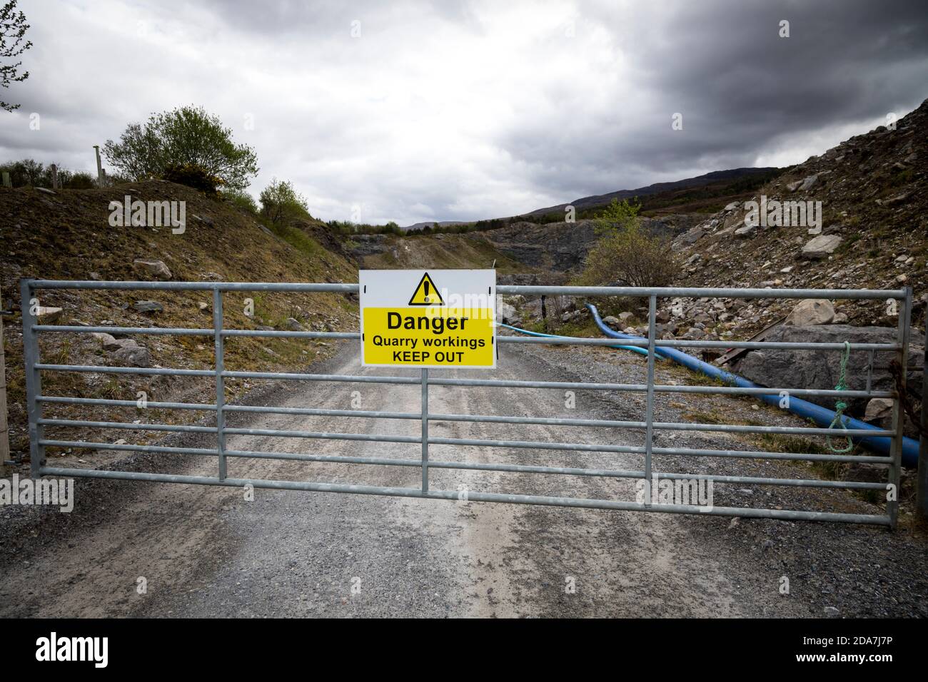 'Danger Quarry workings keep out' sign on a galvanised metal gate at ...