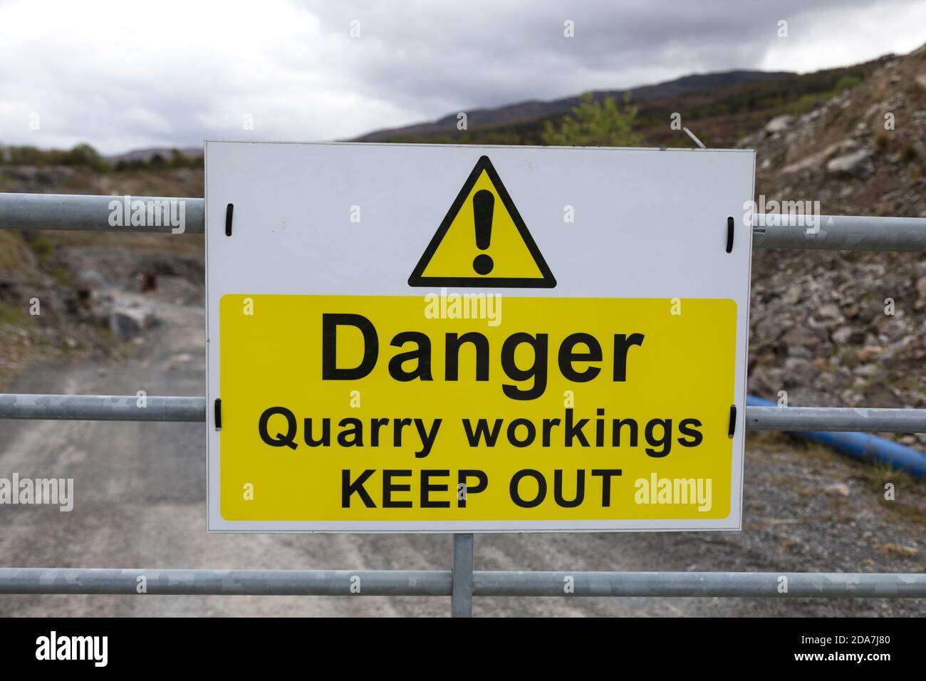 'Danger Quarry workings keep out' sign on a galvanised metal gate at ...