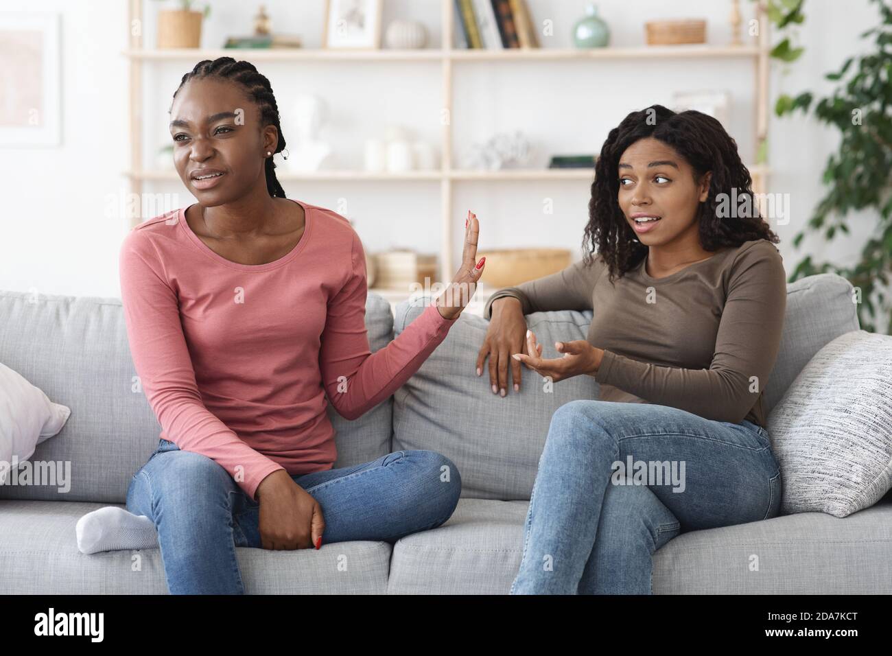 Annoyed woman showing stop gesture to her scolding girlfriend Stock ...