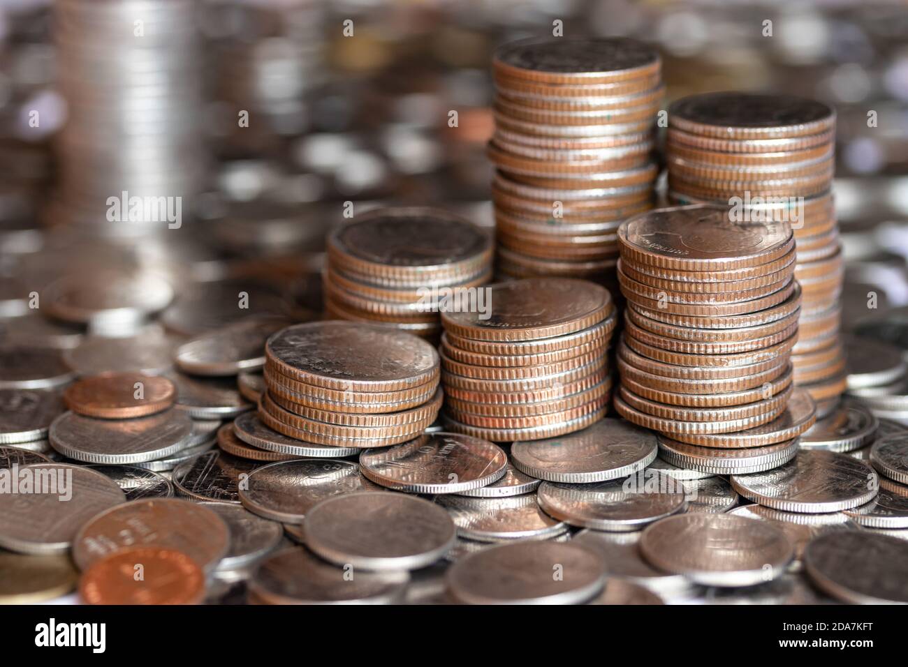 Focus silver coins, golden coins stacked on each other in different ...