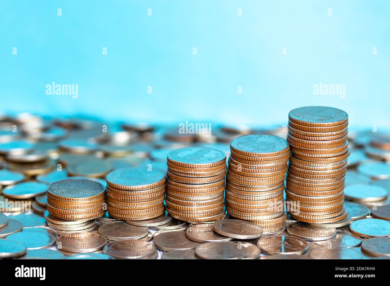 Close up silver coins, golden coins stacked on each other in different ...