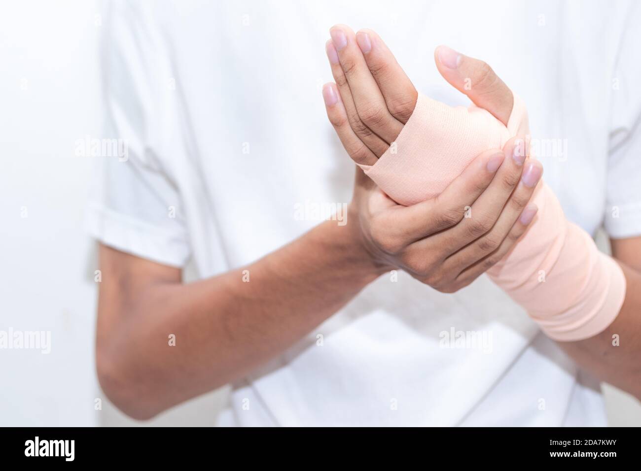 Wrapping hand and arm hi-res stock photography and images - Alamy