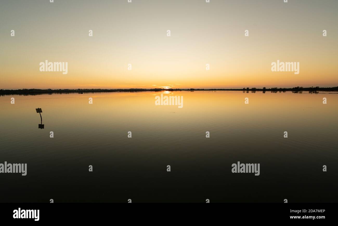 the colors of the light of the setting sun on the lagoon Stock Photo ...