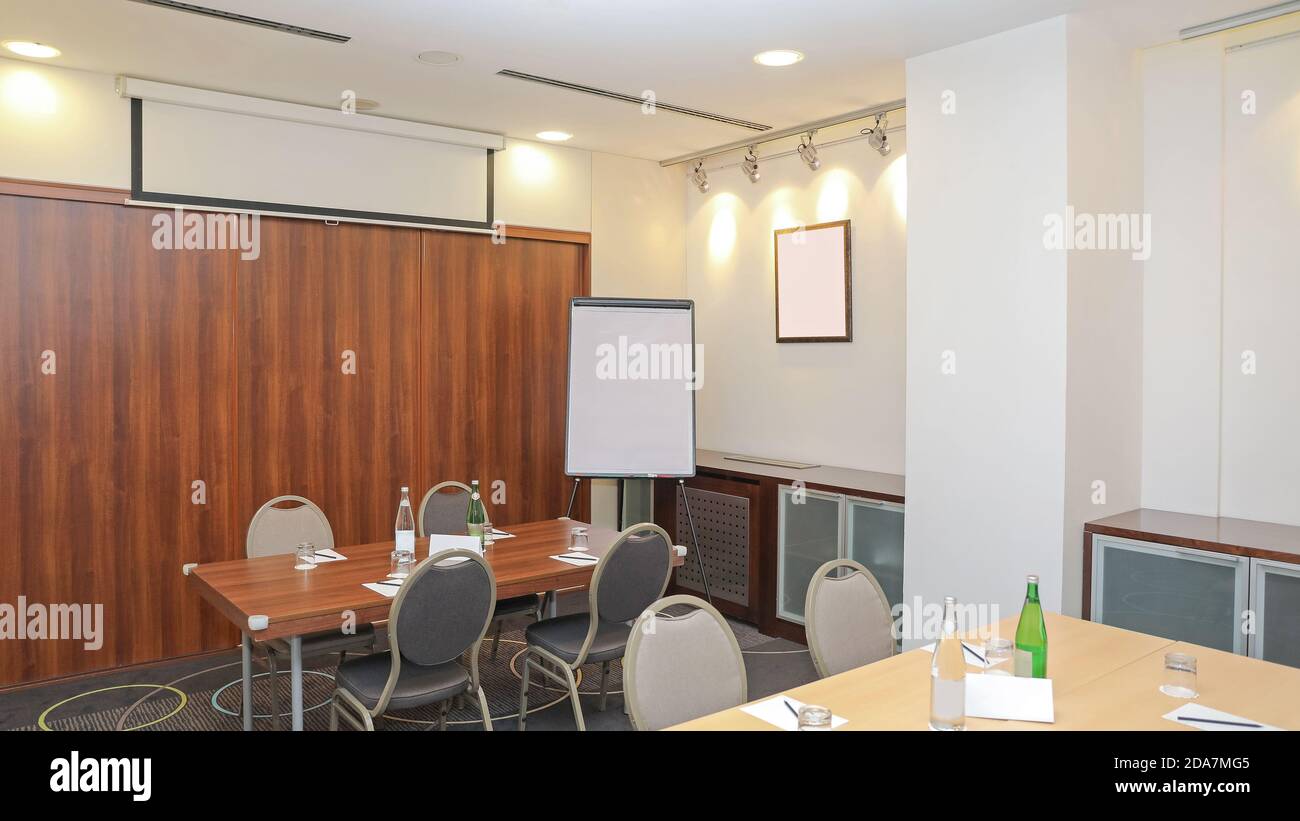 Empty Desks in Meeting Room With White Board Stock Photo - Alamy