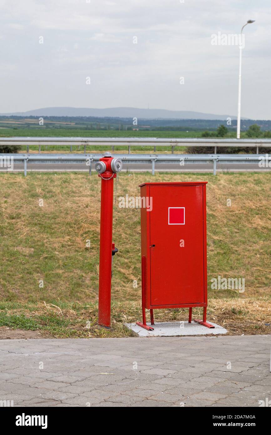Water Hydrant Pipe and Red Box With Fire Fighters Tools Stock Photo - Alamy