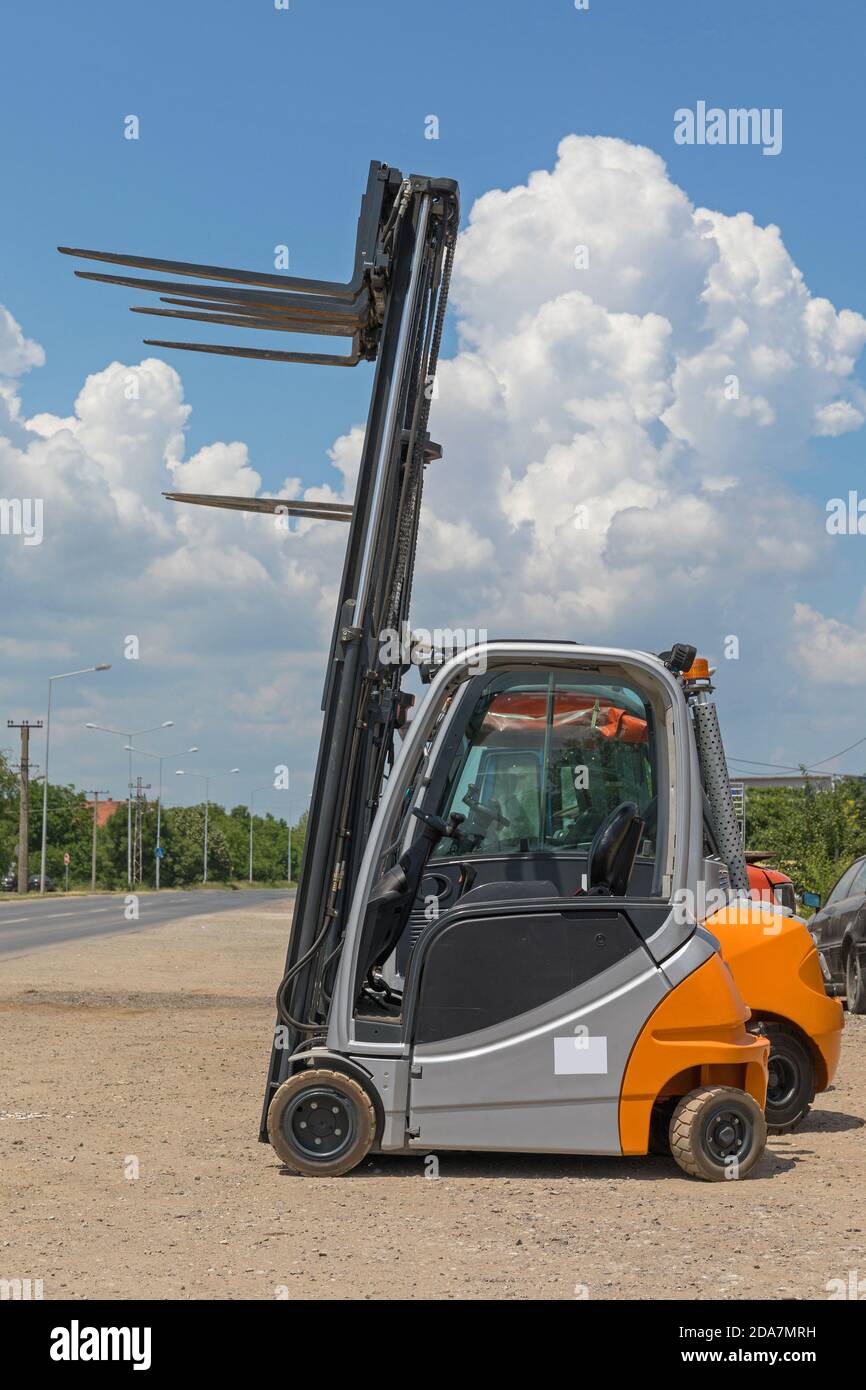 Small Forklift Truck With Cabin Forks Up Stock Photo - Alamy