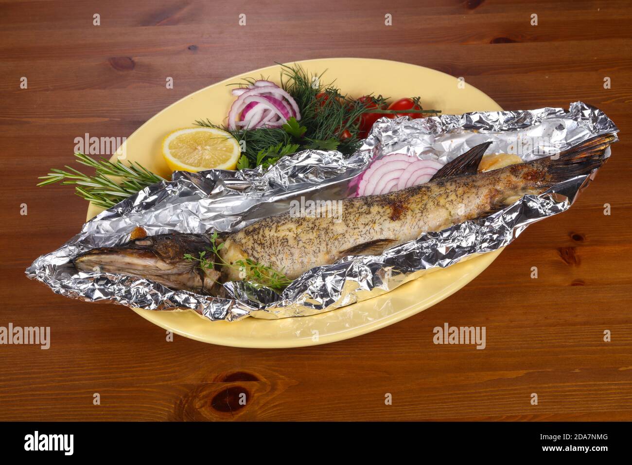Stuffed baked pike with lemon and rosemary Stock Photo - Alamy