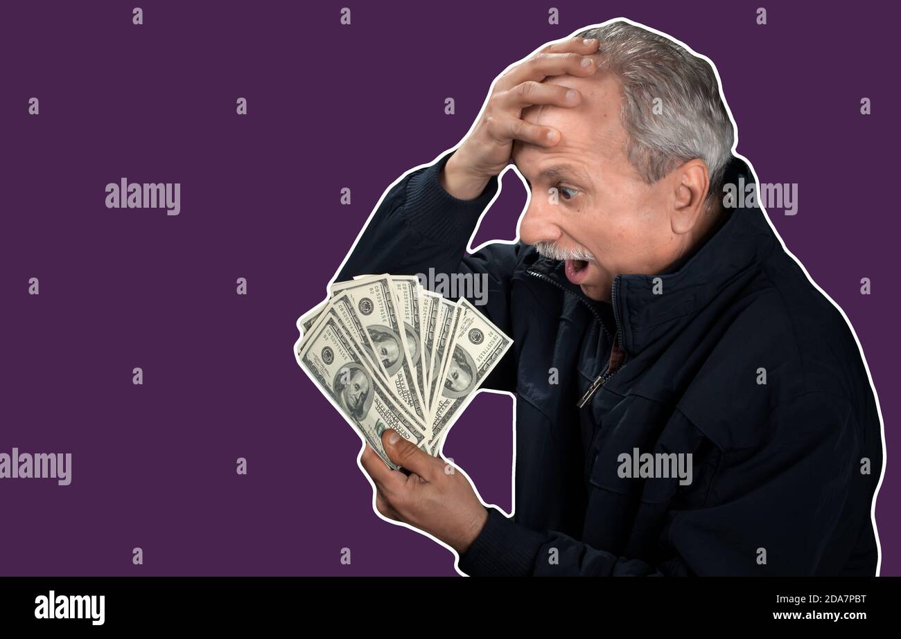 Senior gentleman holding a stack of money. Portrait of an excited old ...