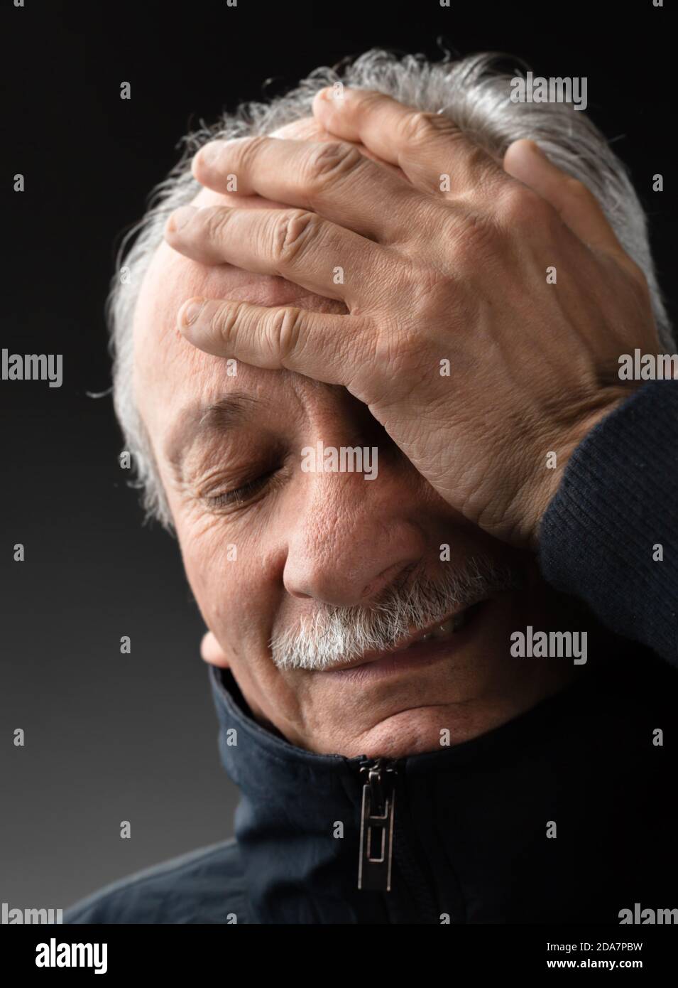 Portrait of an elderly man with a headache. Old man with infection and ...