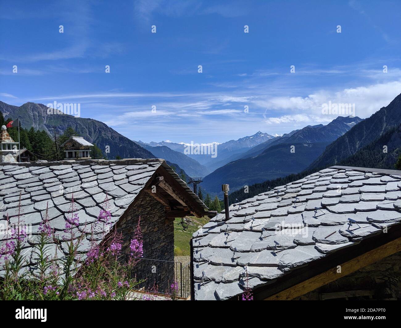 View of mountain peaks in Italian Alpine area between two huts with ...