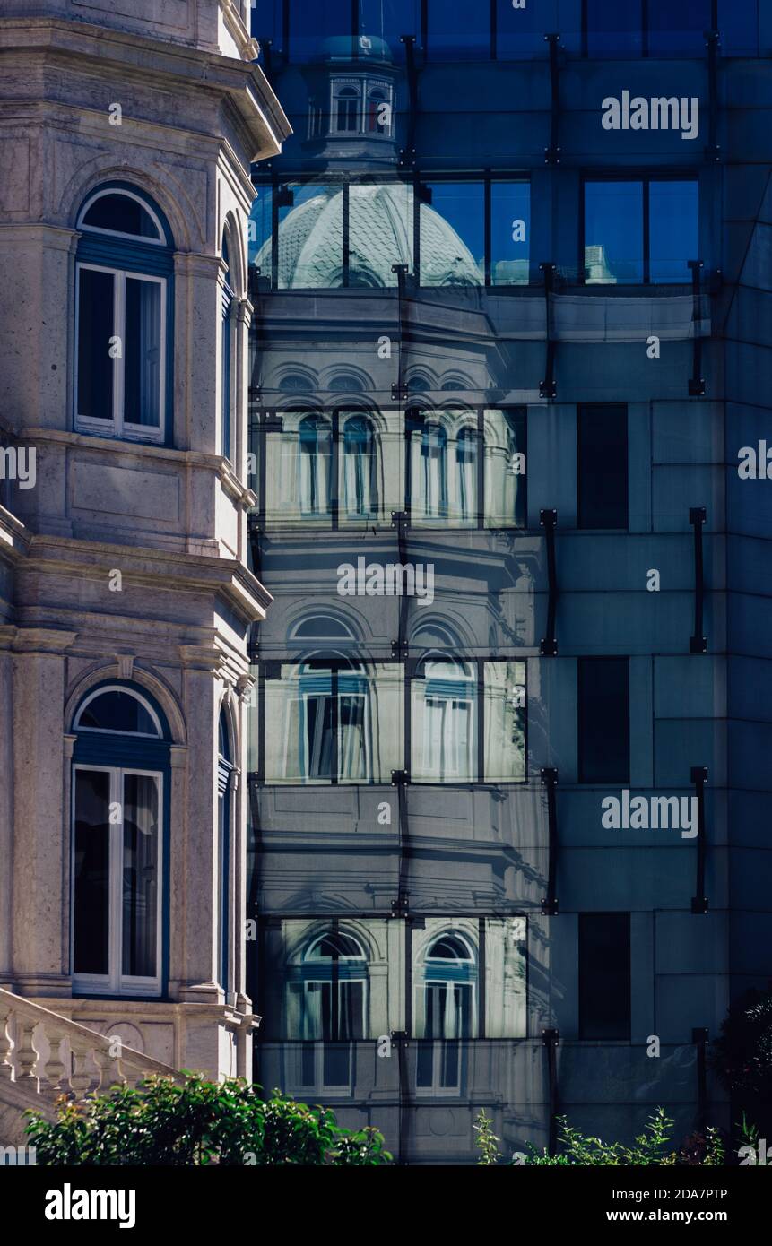 Vertical shot of a building reflecting in glass architecture Stock ...
