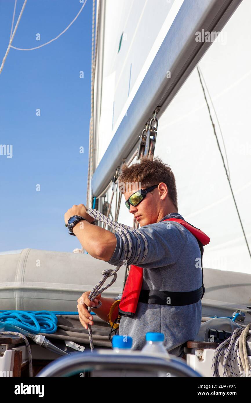 Happy man wheel yacht hi-res stock photography and images - Alamy