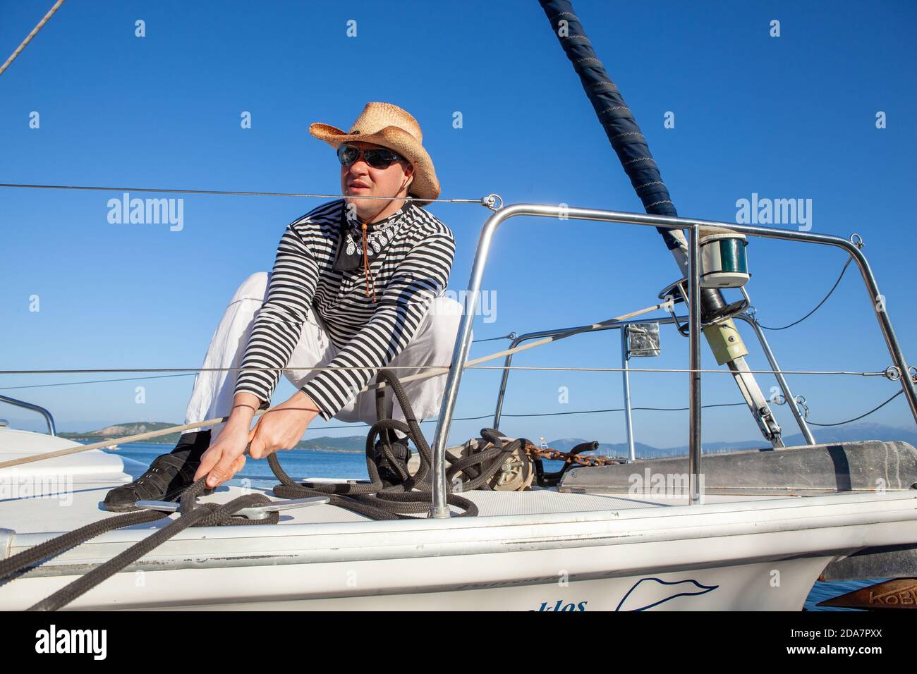 Greece. Corfu 25 October 2016: Young man drives sailing yacht Stock ...