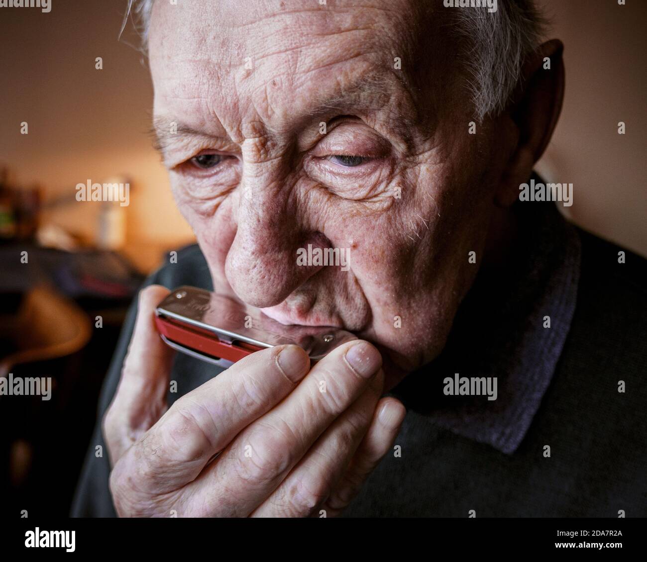 Man playing harmonica hi-res stock photography and images - Alamy