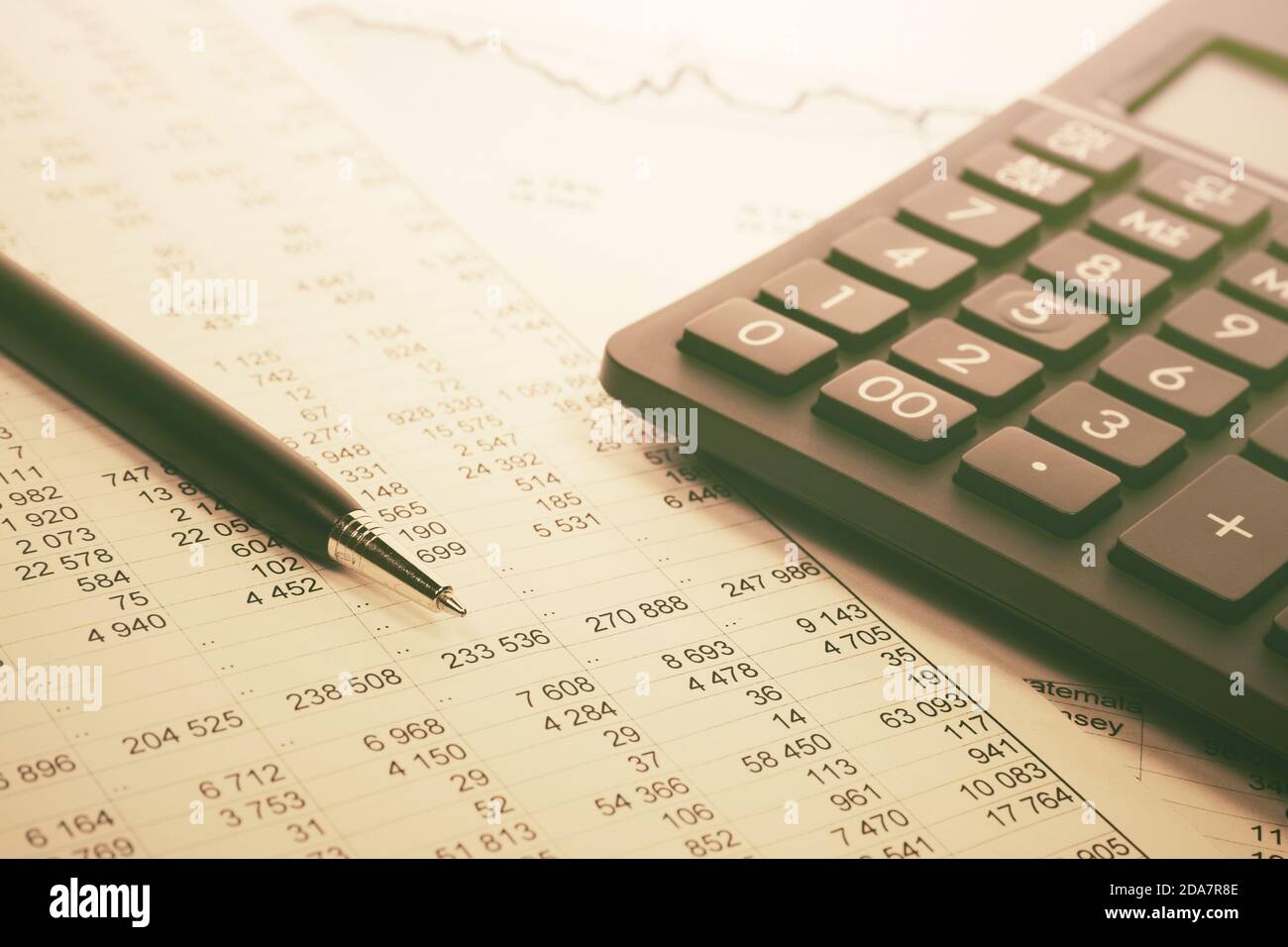 Financial accounting Pen and calculator on balance sheets Stock Photo ...