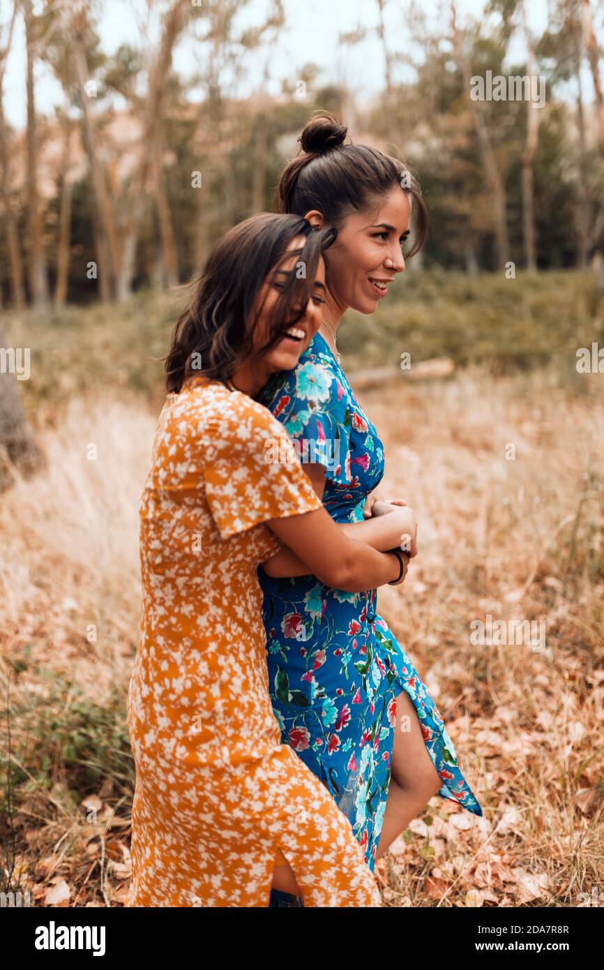 Two young lesbians caressing each other walking in the woods Stock Photo - Alamy