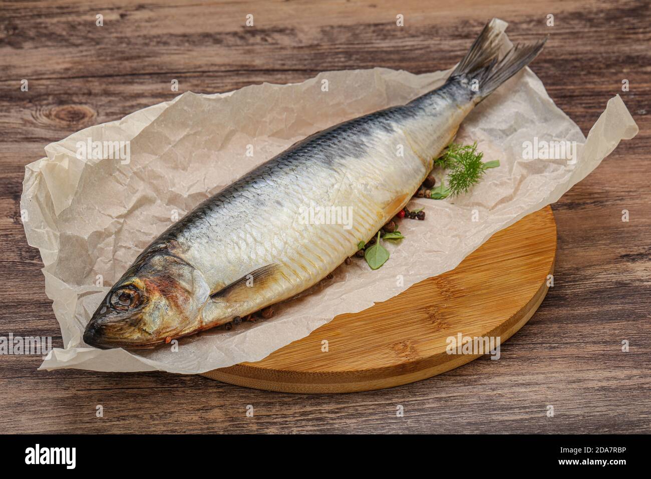 Salted Herring fish with pepper and spices Stock Photo - Alamy