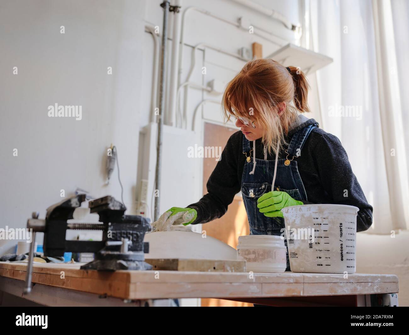 Professional female sculptor working with plaster in her studio Stock ...