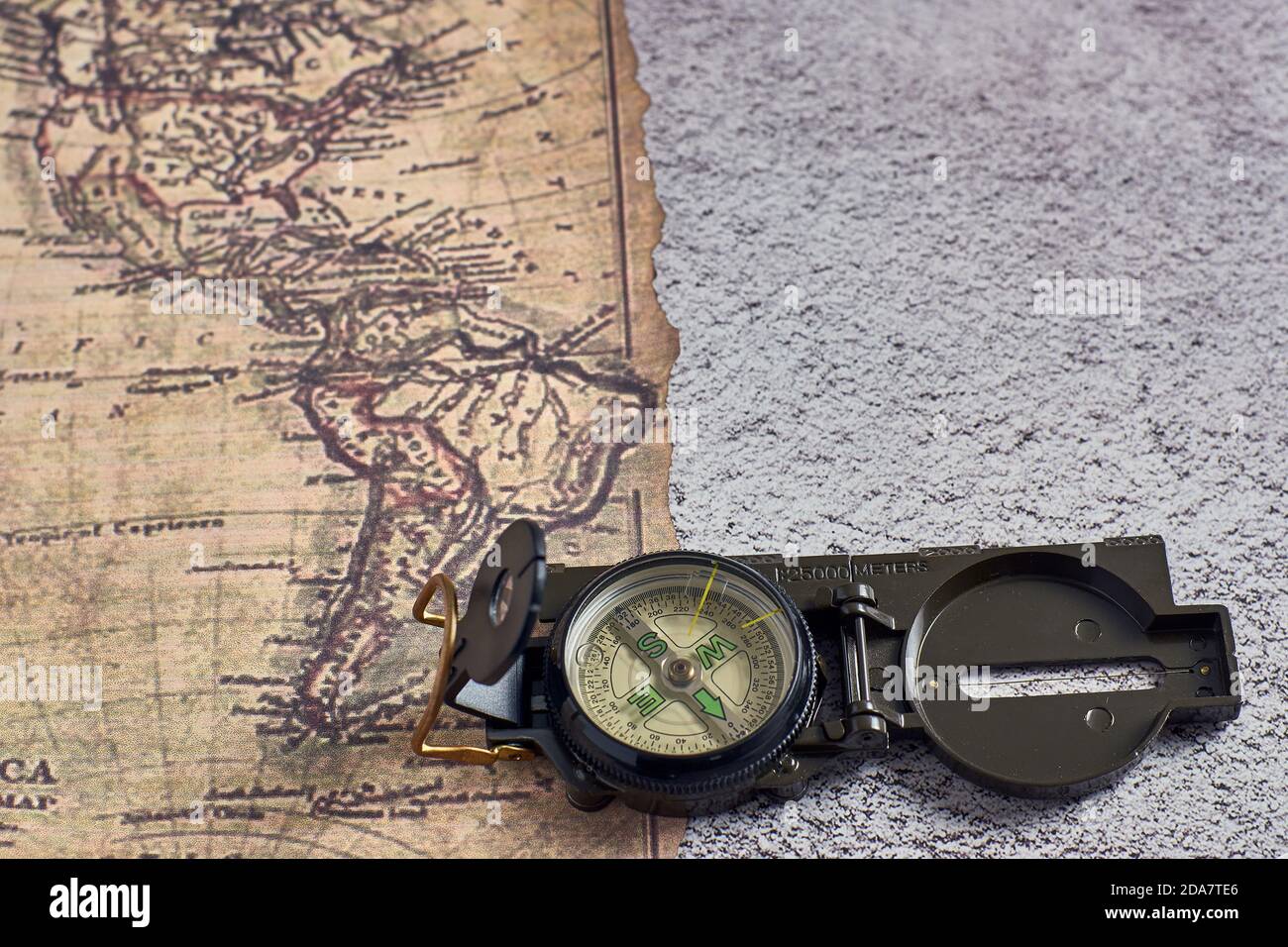 Top view closeup of a compass placed on an ancient map Stock Photo - Alamy
