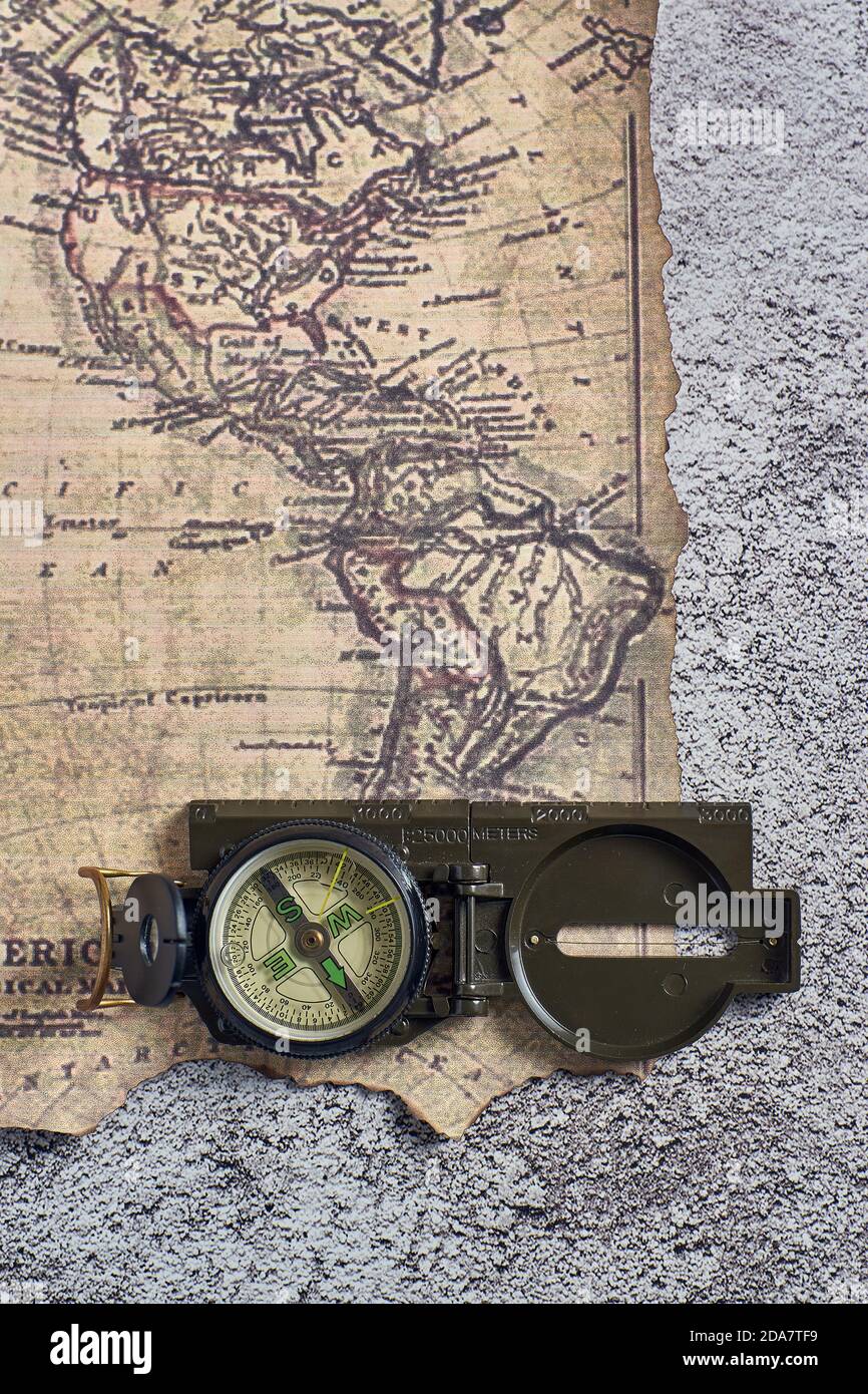 Top view closeup of a compass placed on an ancient map Stock Photo - Alamy