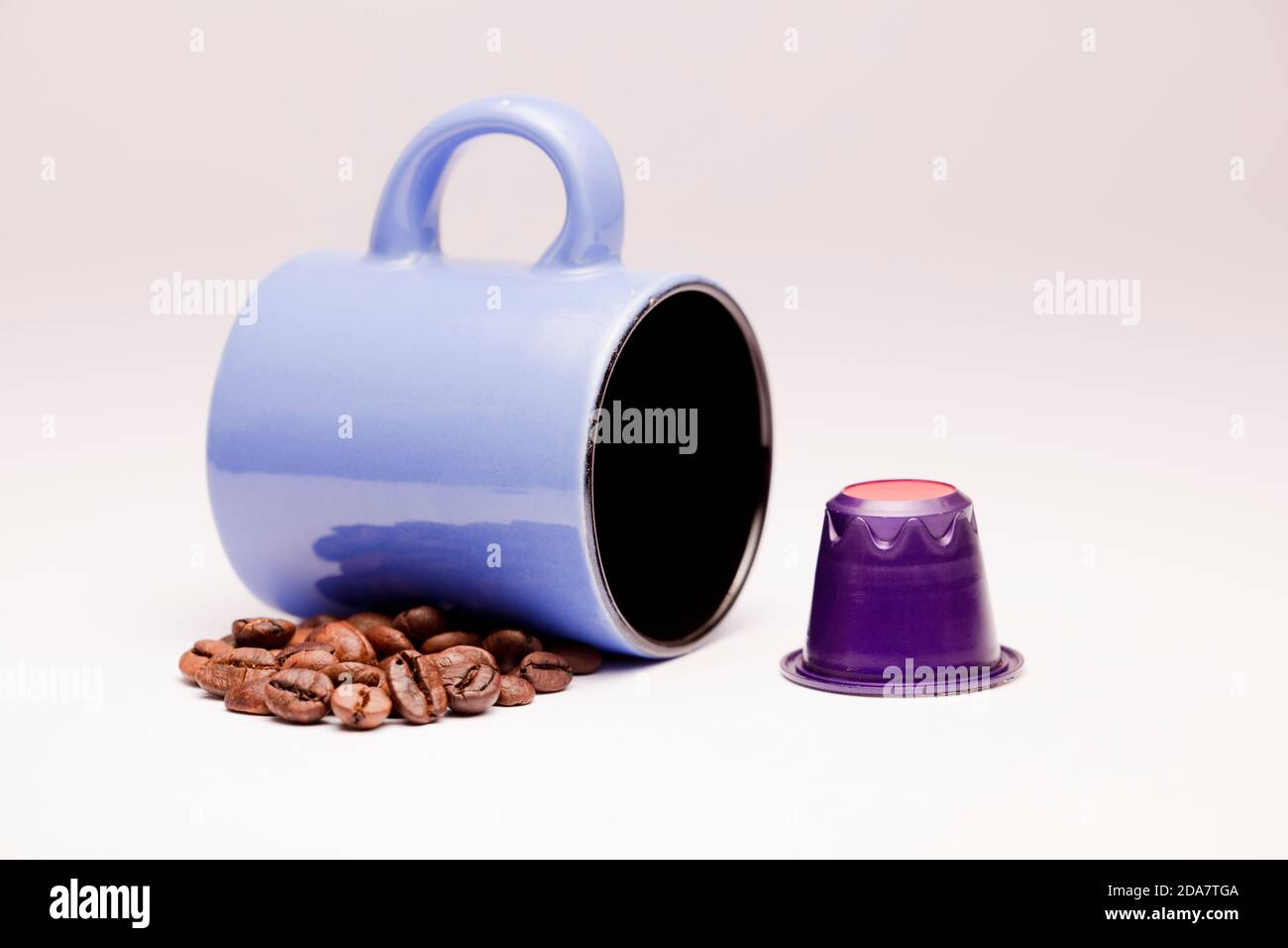 purple coffee capsule, with porcelain cup, with coffee beans, white ...