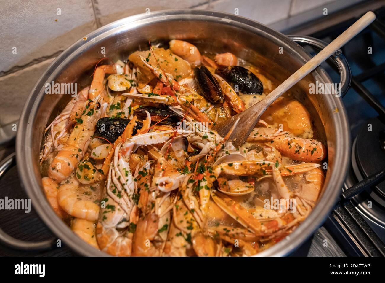 fresh fish soup with scampi and seafood with clams and mussels Stock ...