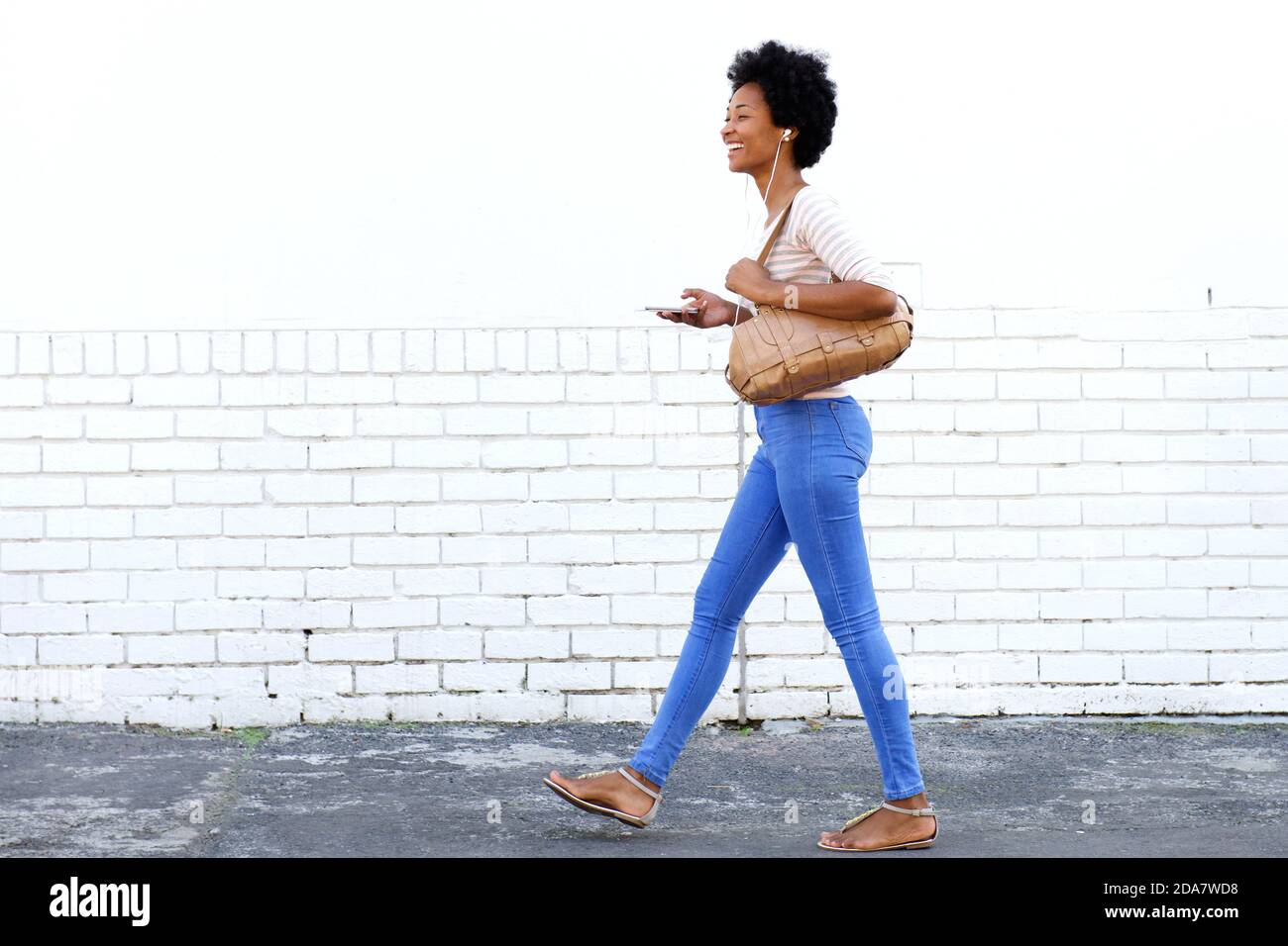 Full body walking profile african hi-res stock photography and images ...